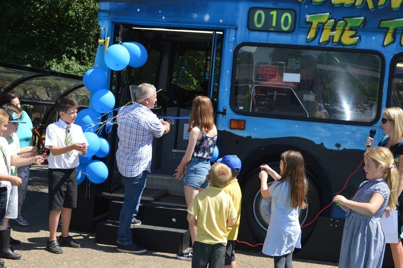 Phelan volunteers transform a bus into a school library! - Phelan ...